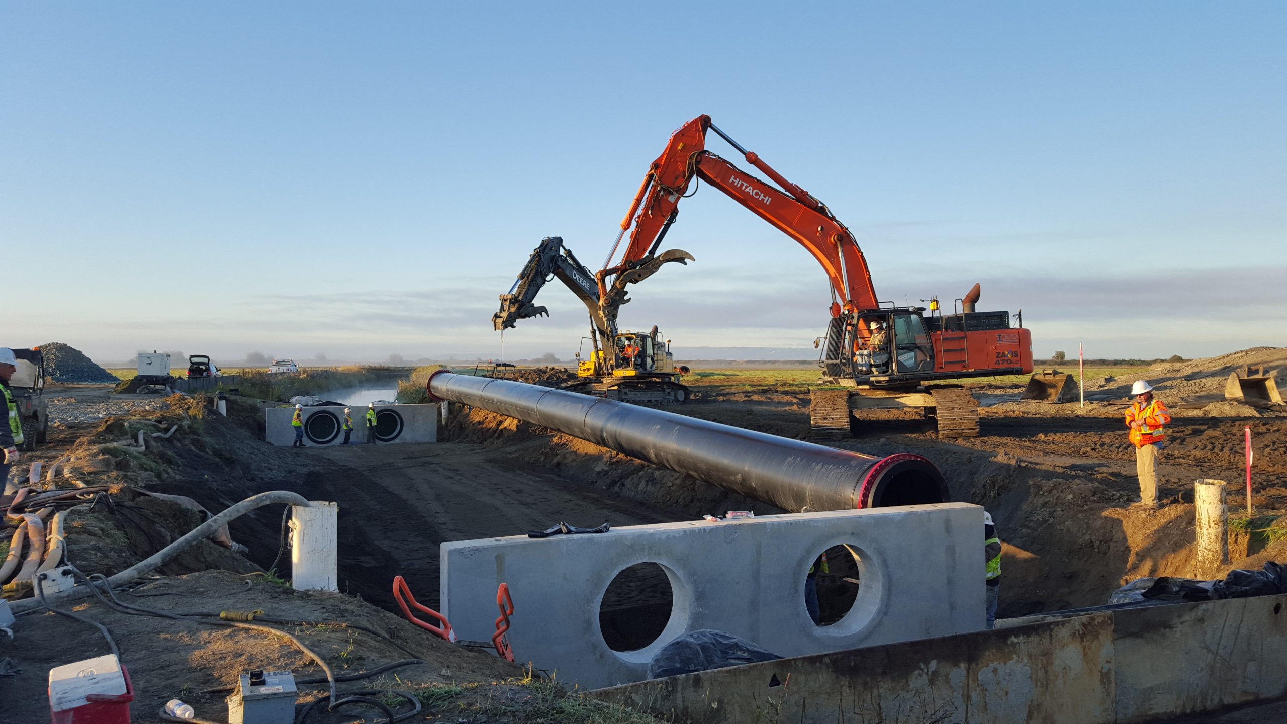 CREWS SET 48-INCH DIAMETER PIPE IN SLOUGH AT FIR ISLAND — IMCO Construction